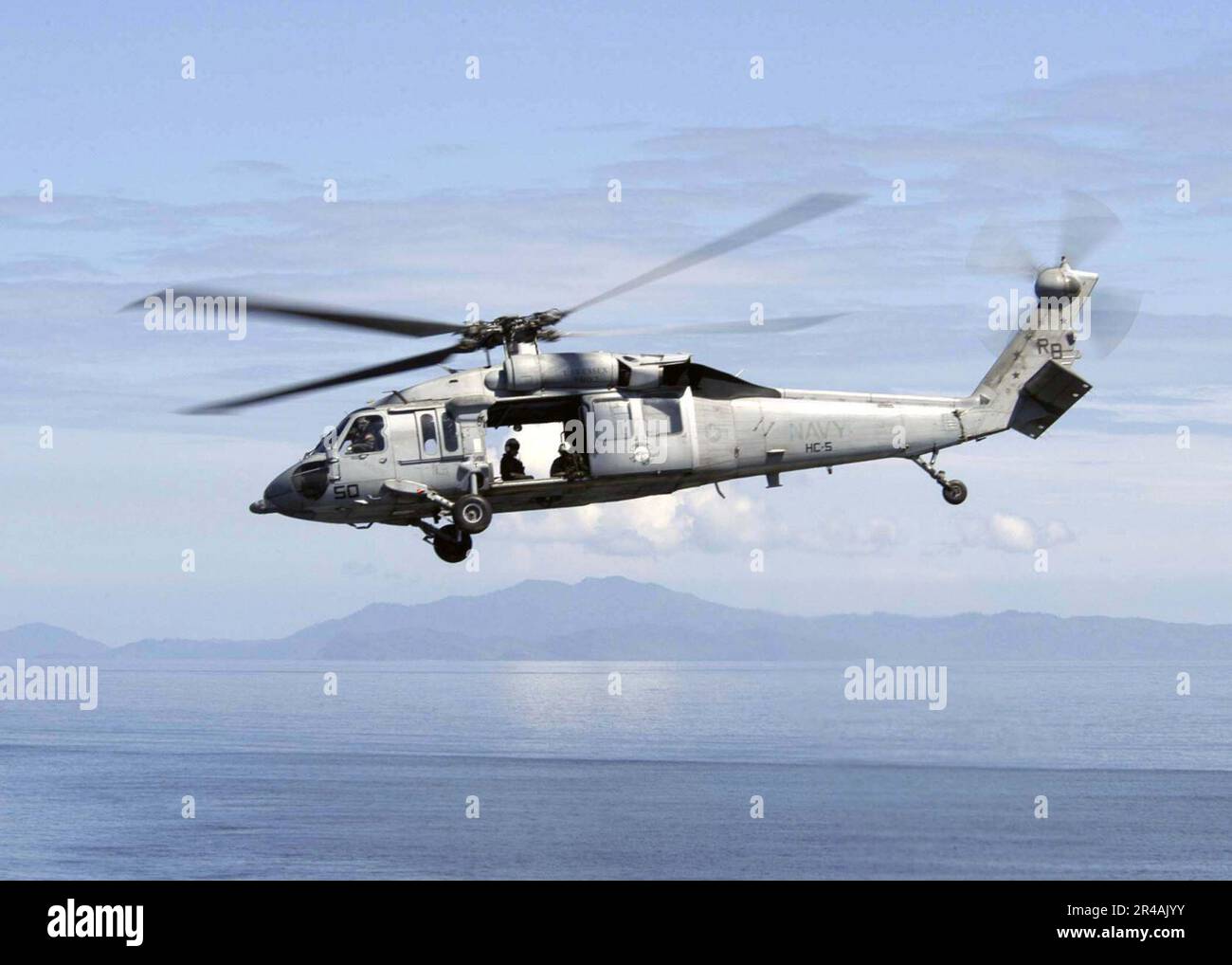 US Navy An MH-60S Knighthawk assigned Helicopter Combat Support Squadron Five (HC-5) returns to ...