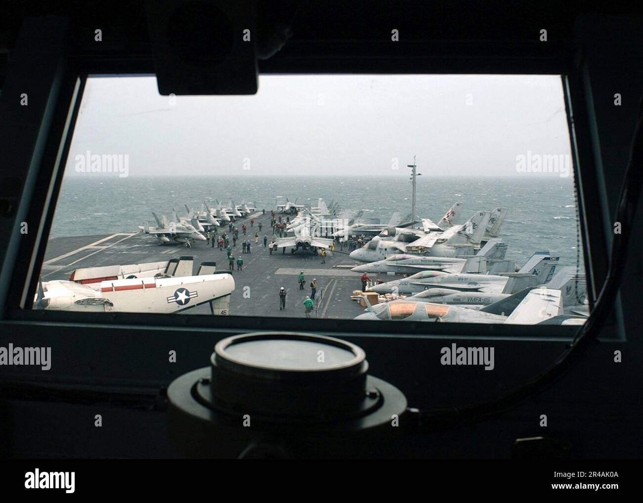 US Navy Flight deck personnel make preparations for flight operations ...