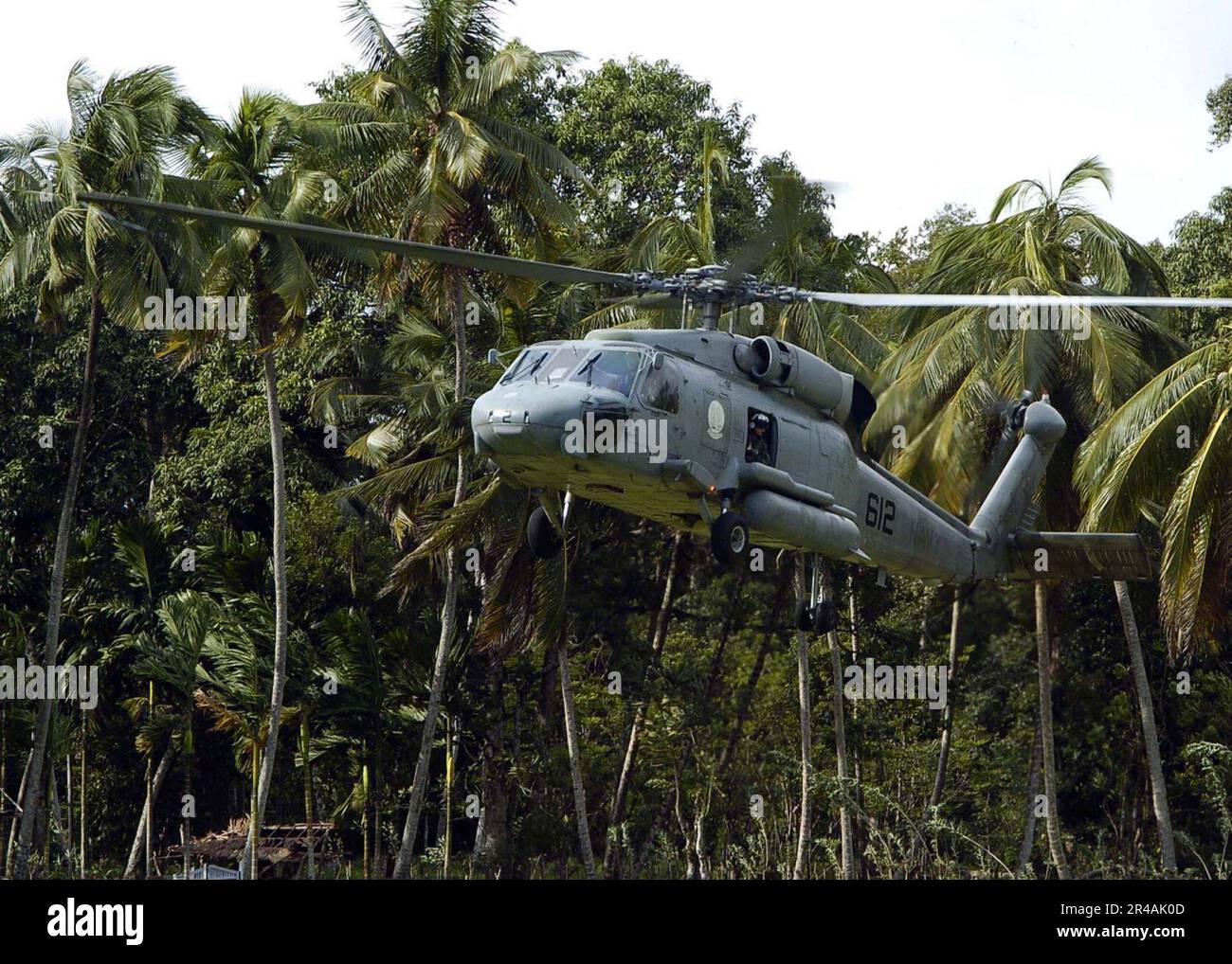 US Navy An SH-60F Seahawk prepares to land in the village of Kuende ...