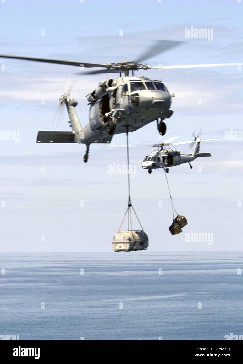 US Navy Two helicopters assigned to Carrier Air Wing Two (CVW-2) bring ...