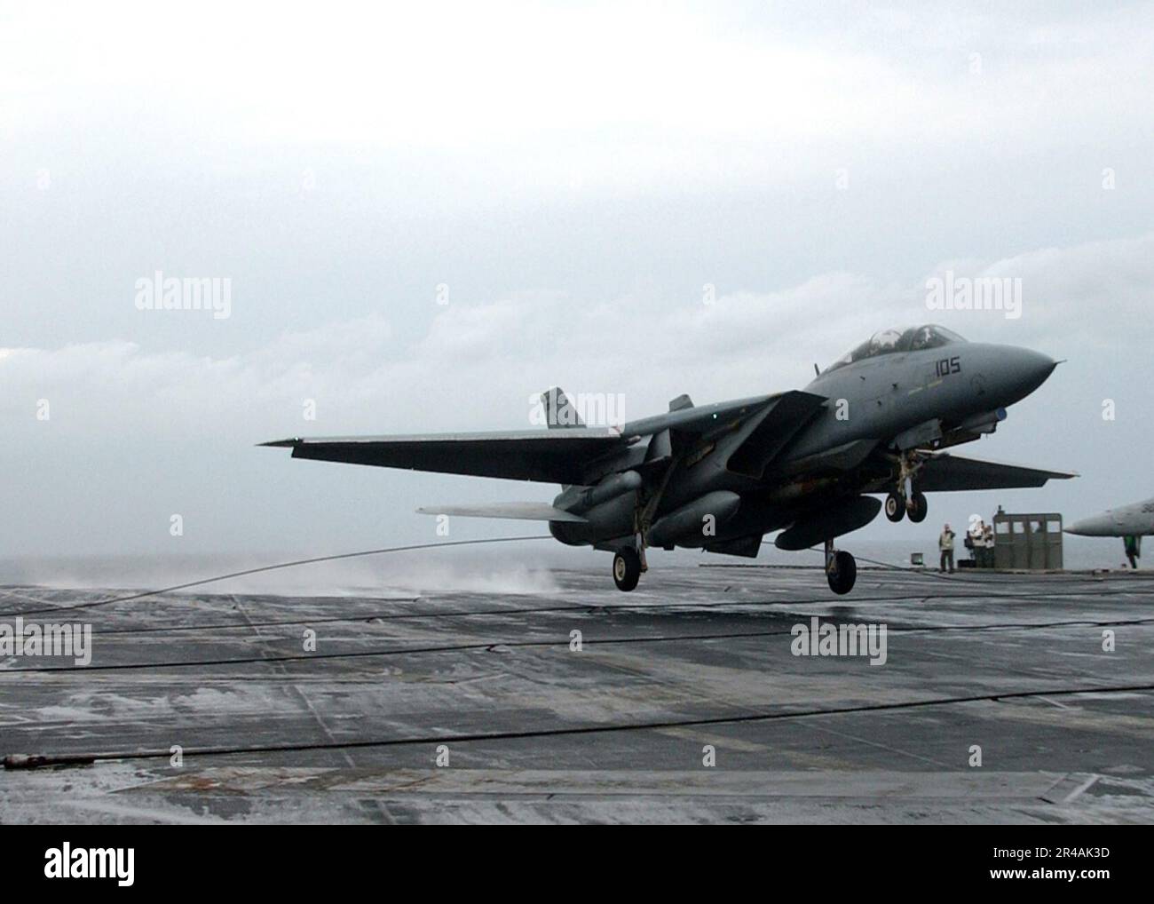 US Navy An F-14B Tomcat snags arresting wire number one prior to ...