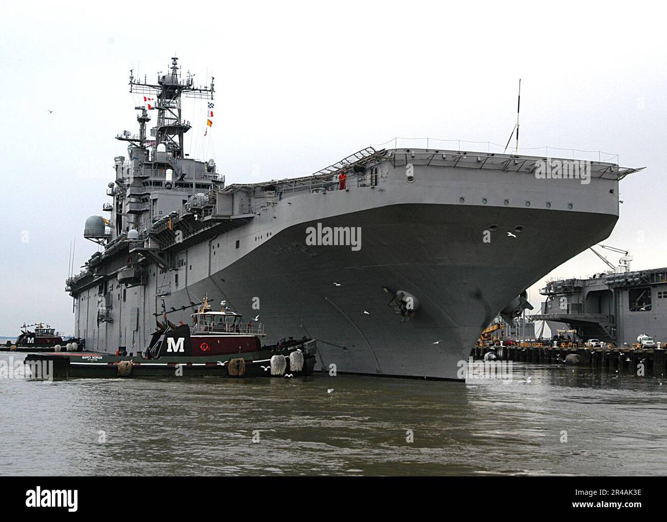 US Navy The amphibious assault ship USS Saipan (LHA 2) pulls away from ...