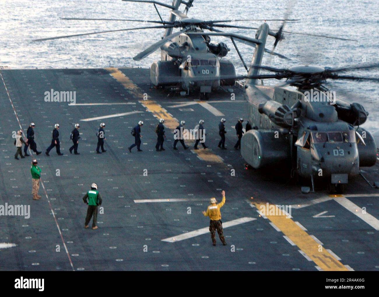 US Navy Sailors board an MH-53E Sea Dragon assigned to the ''Blackhawks ...