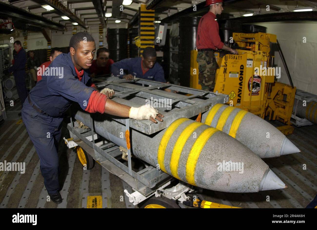 US Navy Sailors assigned to the Weapons Department aboard USS Kitty ...