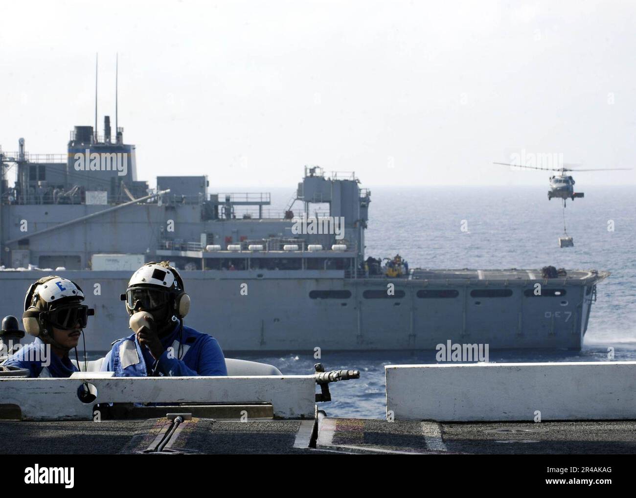 US Navy Sailors assigned to the Air Department aboard USS Abraham ...