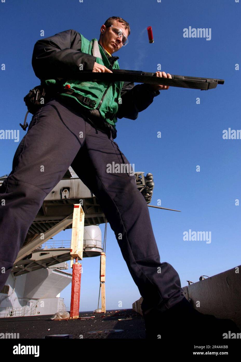 US Navy An empty shotgun shell is ejected as a Sailor clears the ...