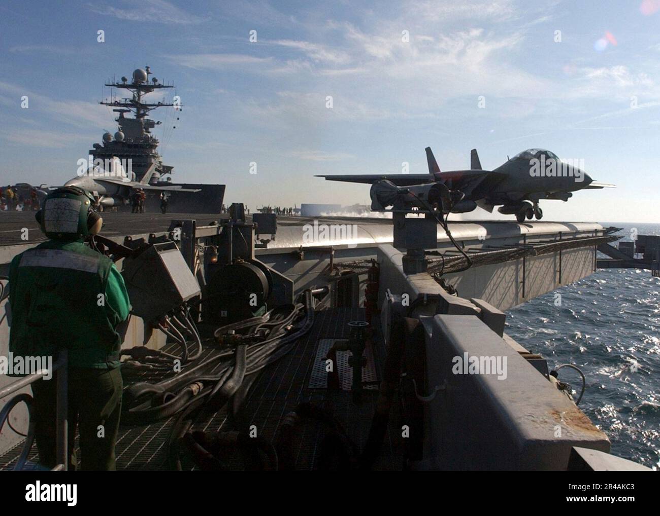 US Navy An F-14B Tomcat launches from the flight deck of the Nimitz ...
