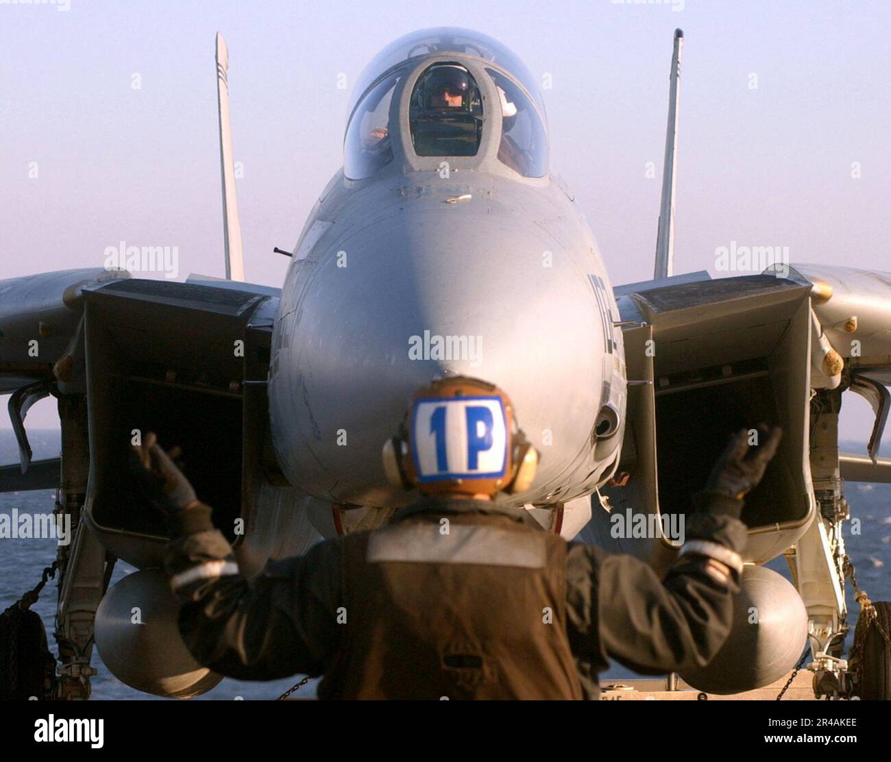 US Navy A plane captain assigned to the Swordsmen of Fighter Squadron ...
