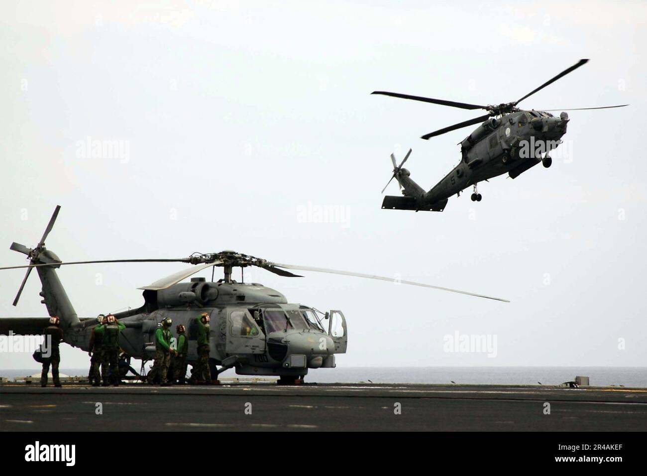 US Navy An SH-60B Seahawk helicopter, assigned to the Saberhawks of ...