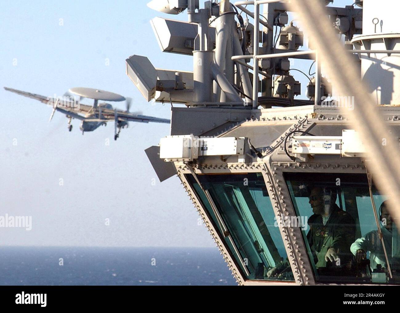 US Navy Assistant Air Boss Cmdr. Doug Castern, observes flight ...