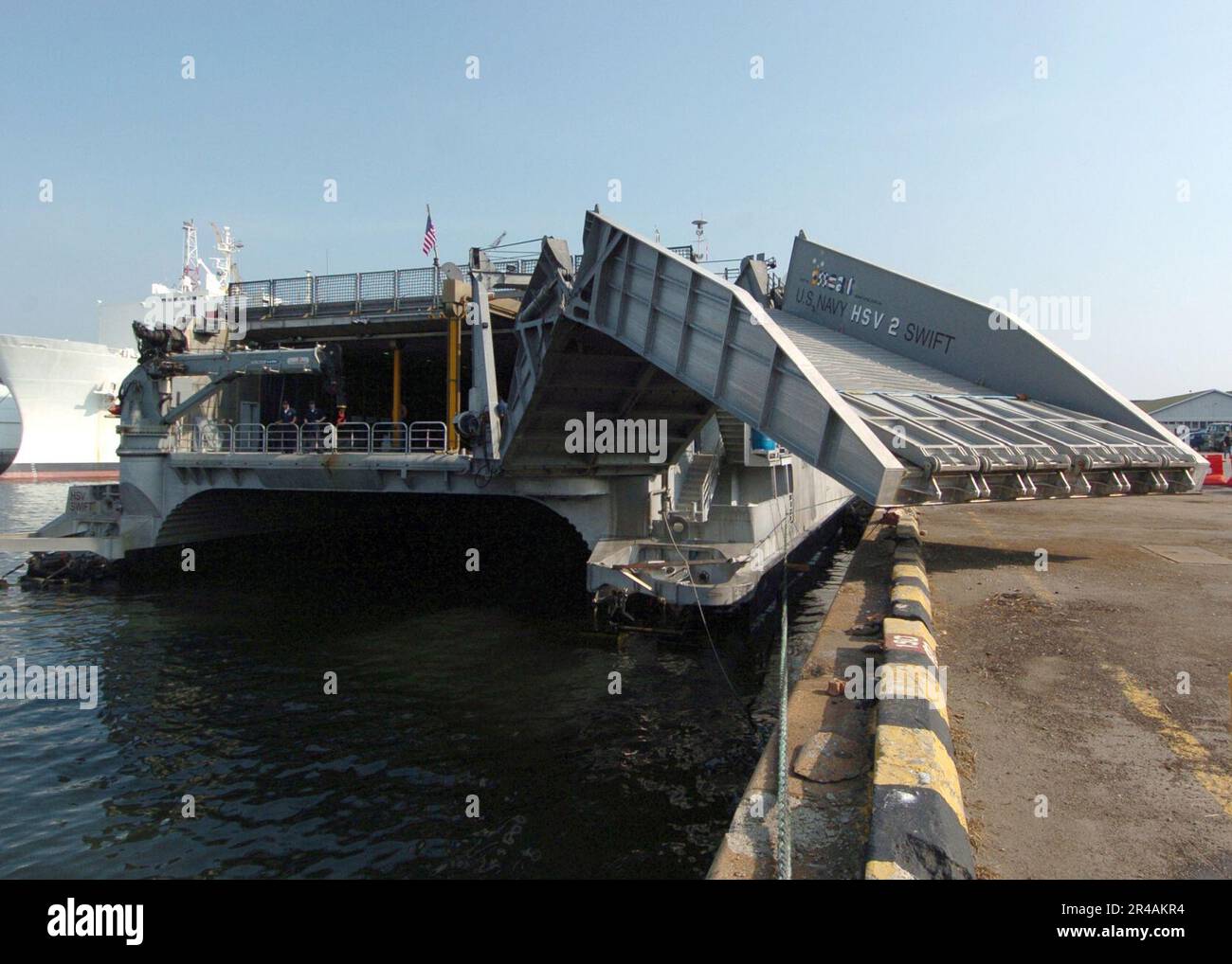 US Navy High Speed Vessel Two (HSV 2) Swift lowers its ramp onto the ...