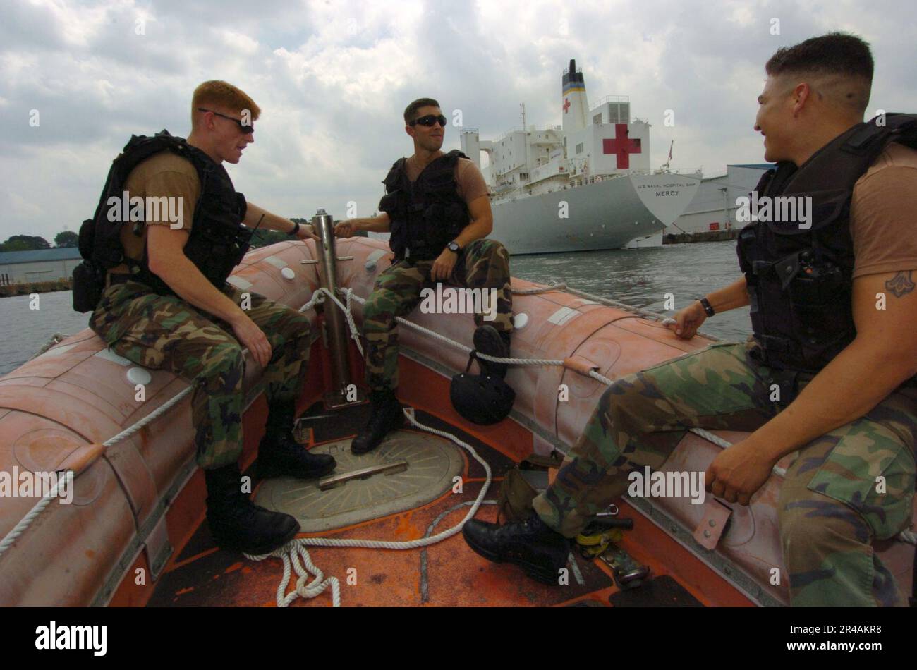 US Navy Master at Arms Second Class Tyler Kearsley, left, Master at ...