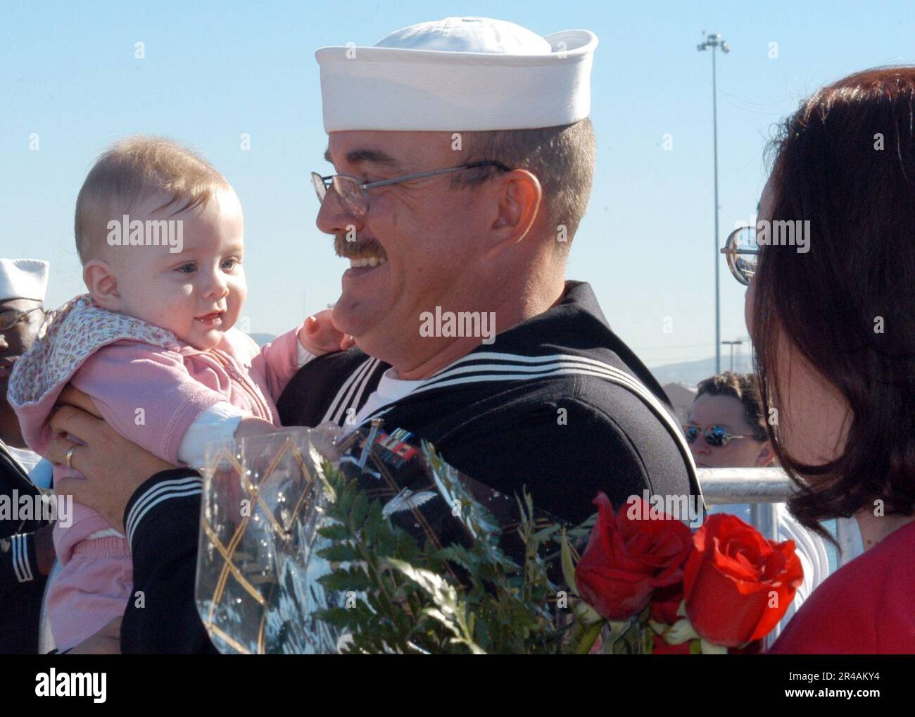 US Navy A Sailor embraces his family after returning from a Western ...