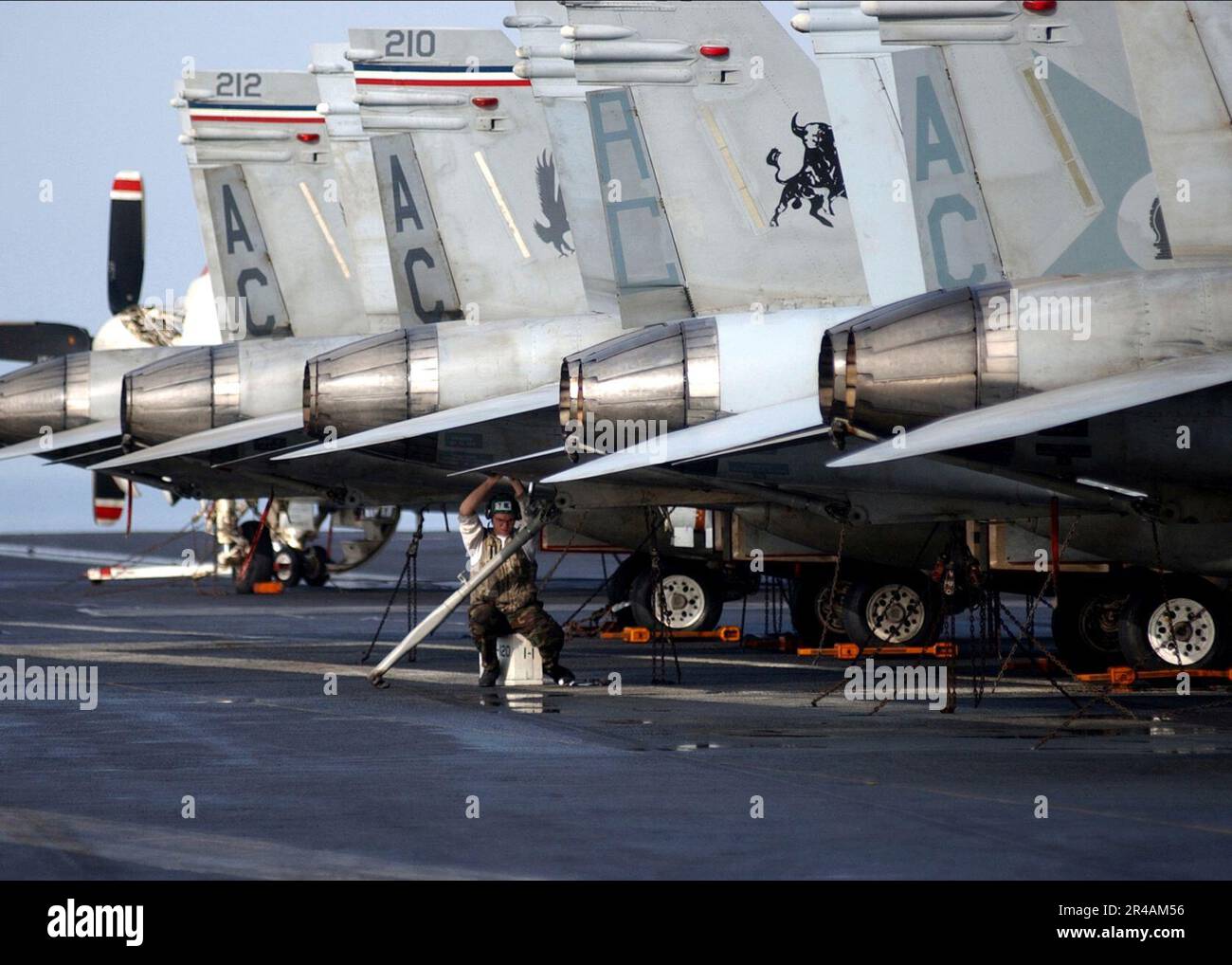 US Navy A member of the airframes shop performs maintenance on a tail ...
