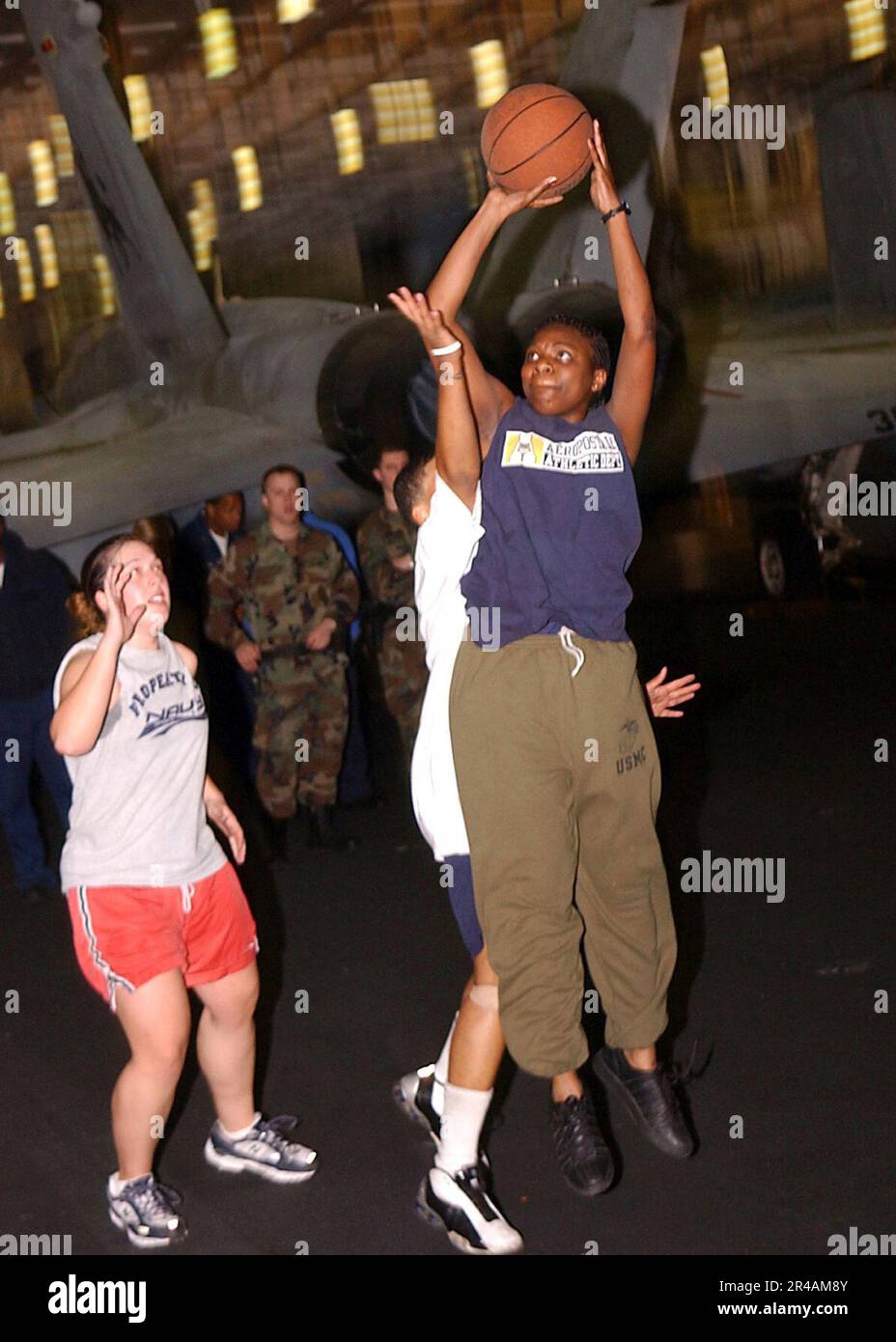 US Navy Sailors play in a 3-on-3 basketball tournament in the hangar ...