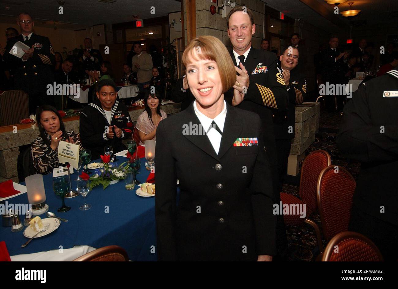 US Navy Legalman 1st Class stands during a round of applause after ...