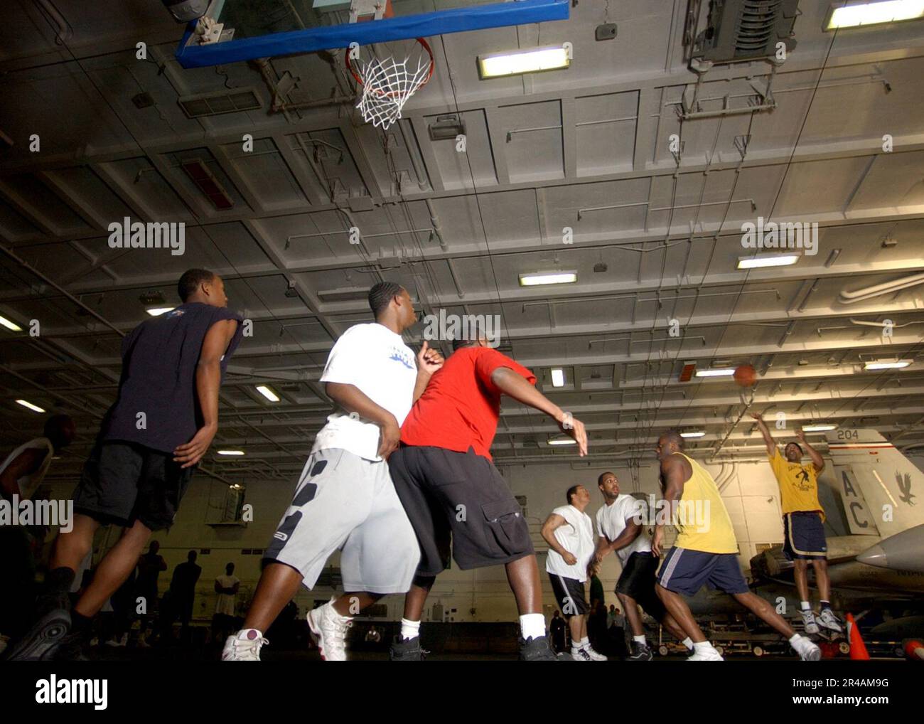 US Navy Sailors play a 4-on-4 basketball tournament in the hangar bay ...