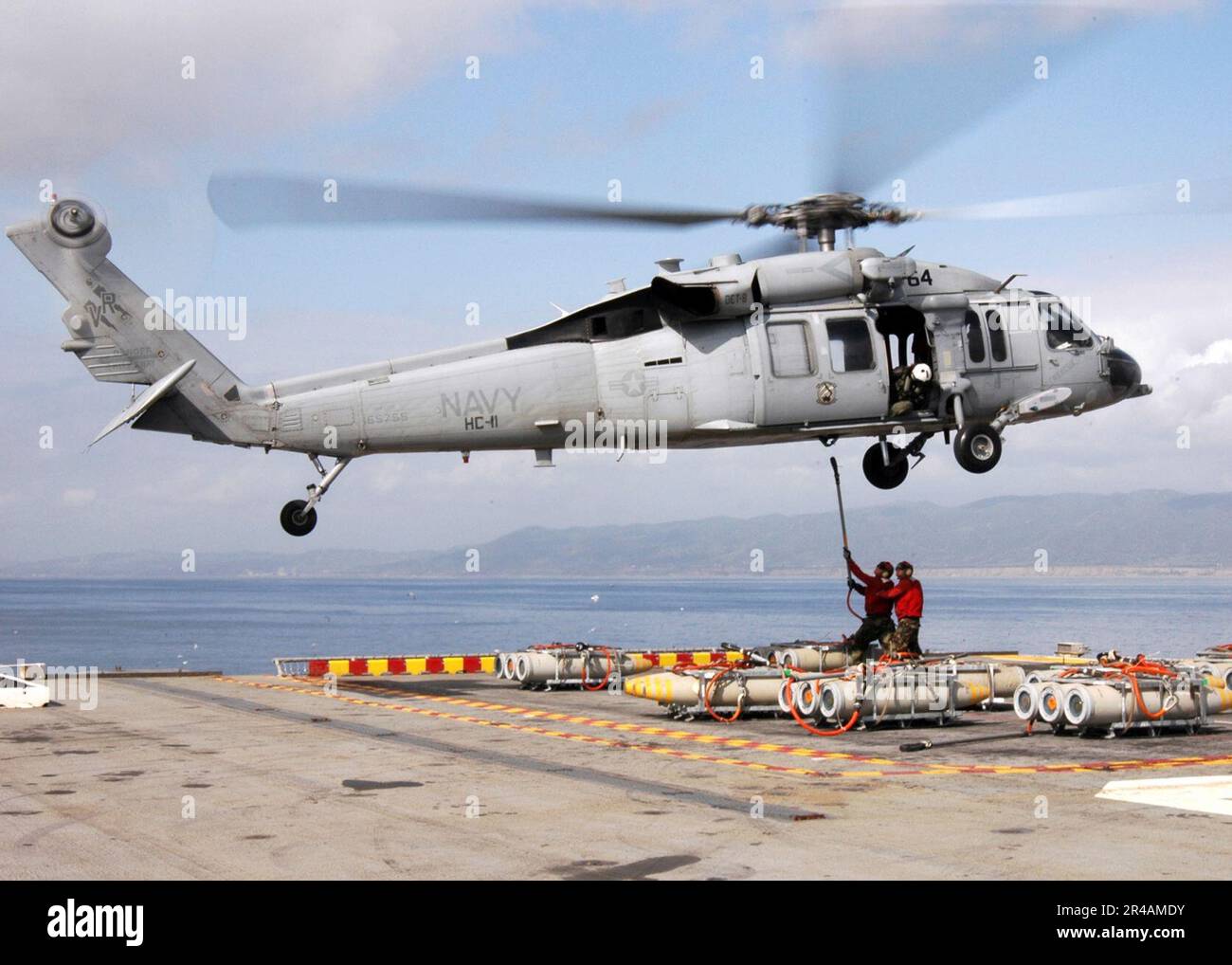 US Navy An MH-60S Knighthawk helicopter prepares for departure from the ...