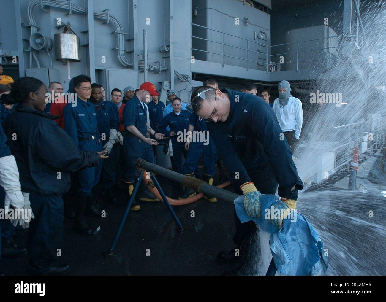 US Navy Sailor participate in a pipe patching exercise on the fantail ...