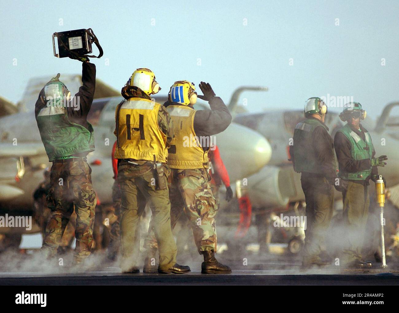 US Navy Sailors assigned to the Air Department prepare to launch an ...