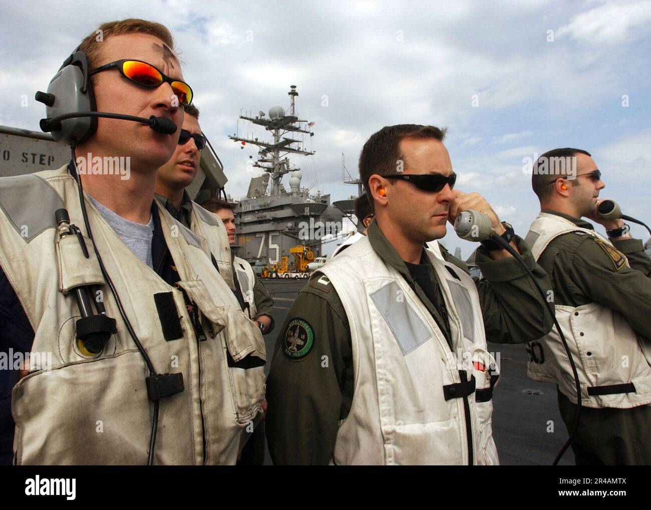 US Navy Landing Signal Officers (LSO) observe aircraft recovery ...