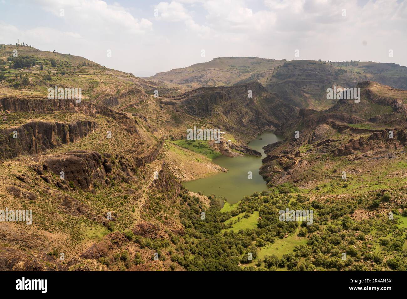 Aerial view of the Rio River and its surrounding lush, green hills ...