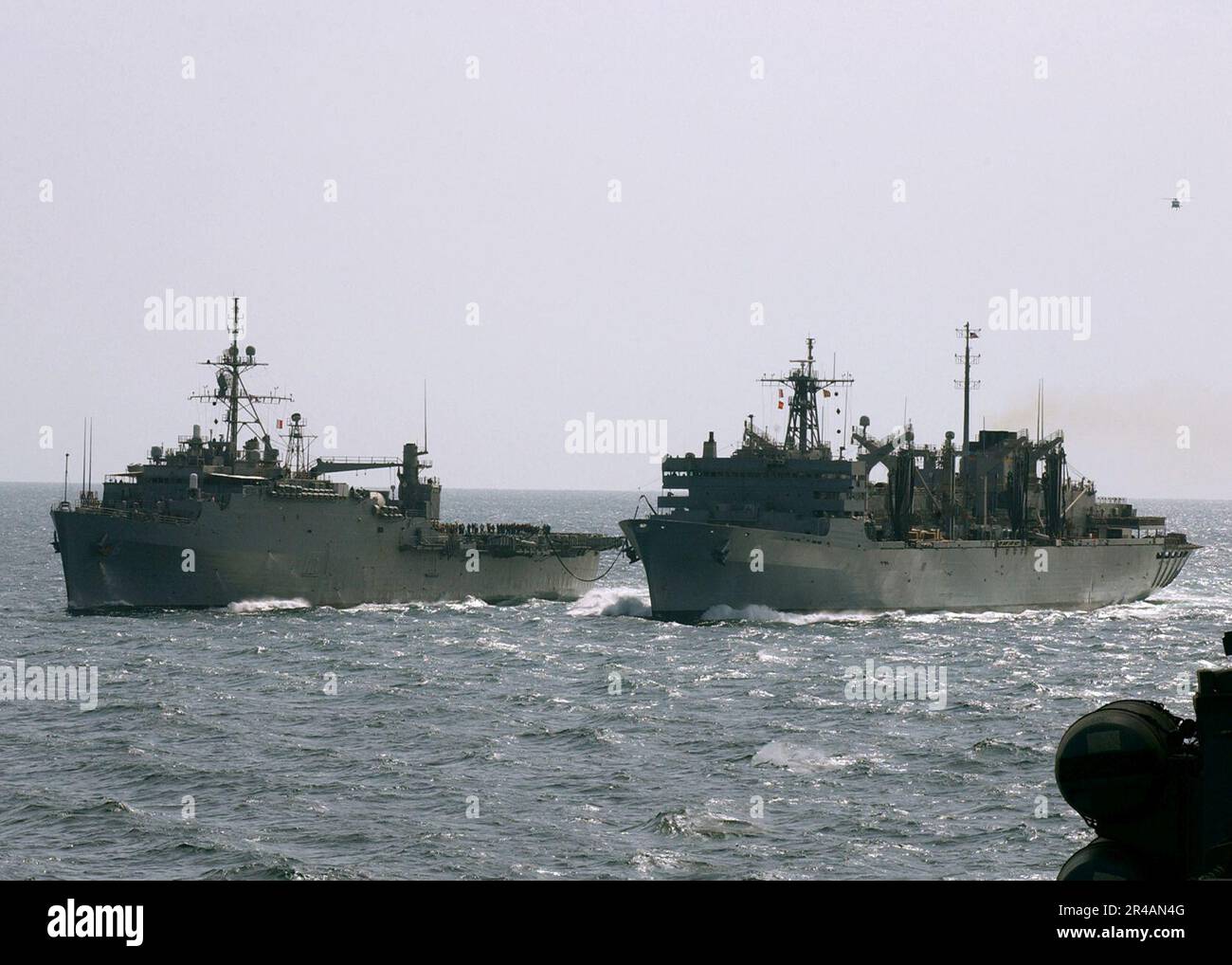 US Navy The amphibious transport dock ship USS Duluth (LPD 6), left ...
