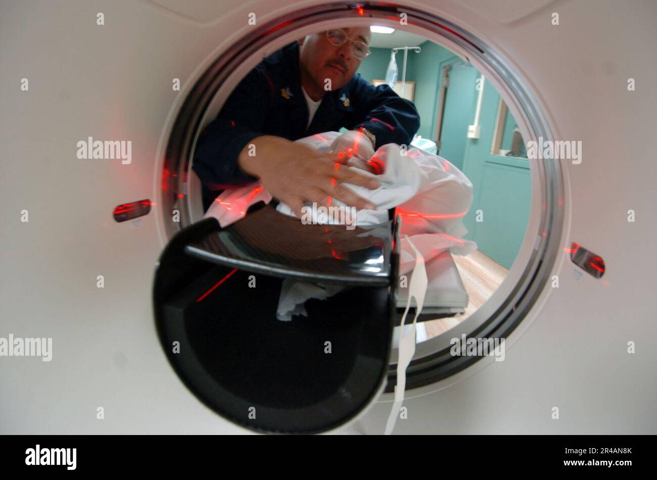US Navy Hospital Corpsman 1st Class positions the head of an Indonesian ...