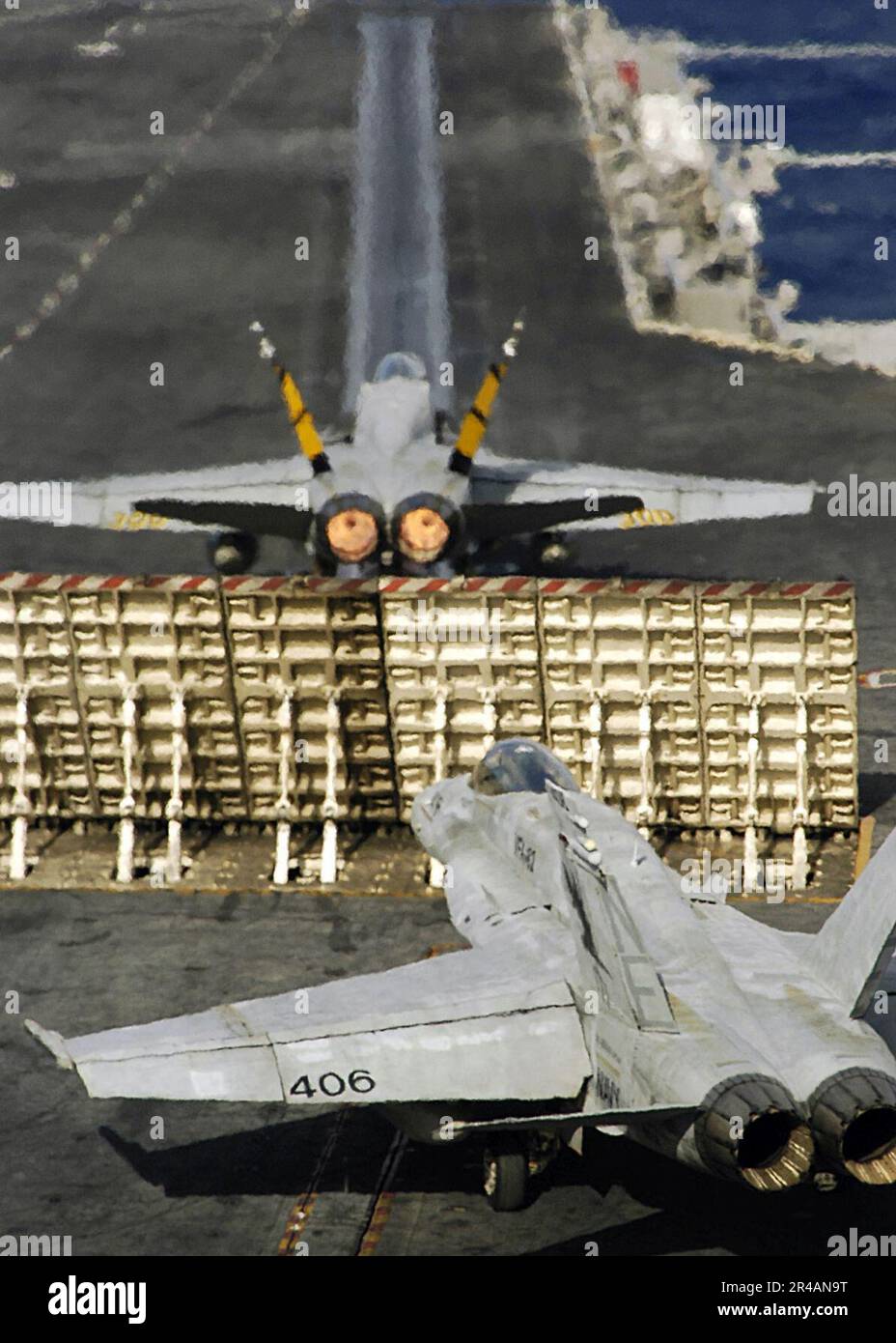 US Navy An F-A-18C Hornet, launches as another F-A-18 Hornet prepares ...