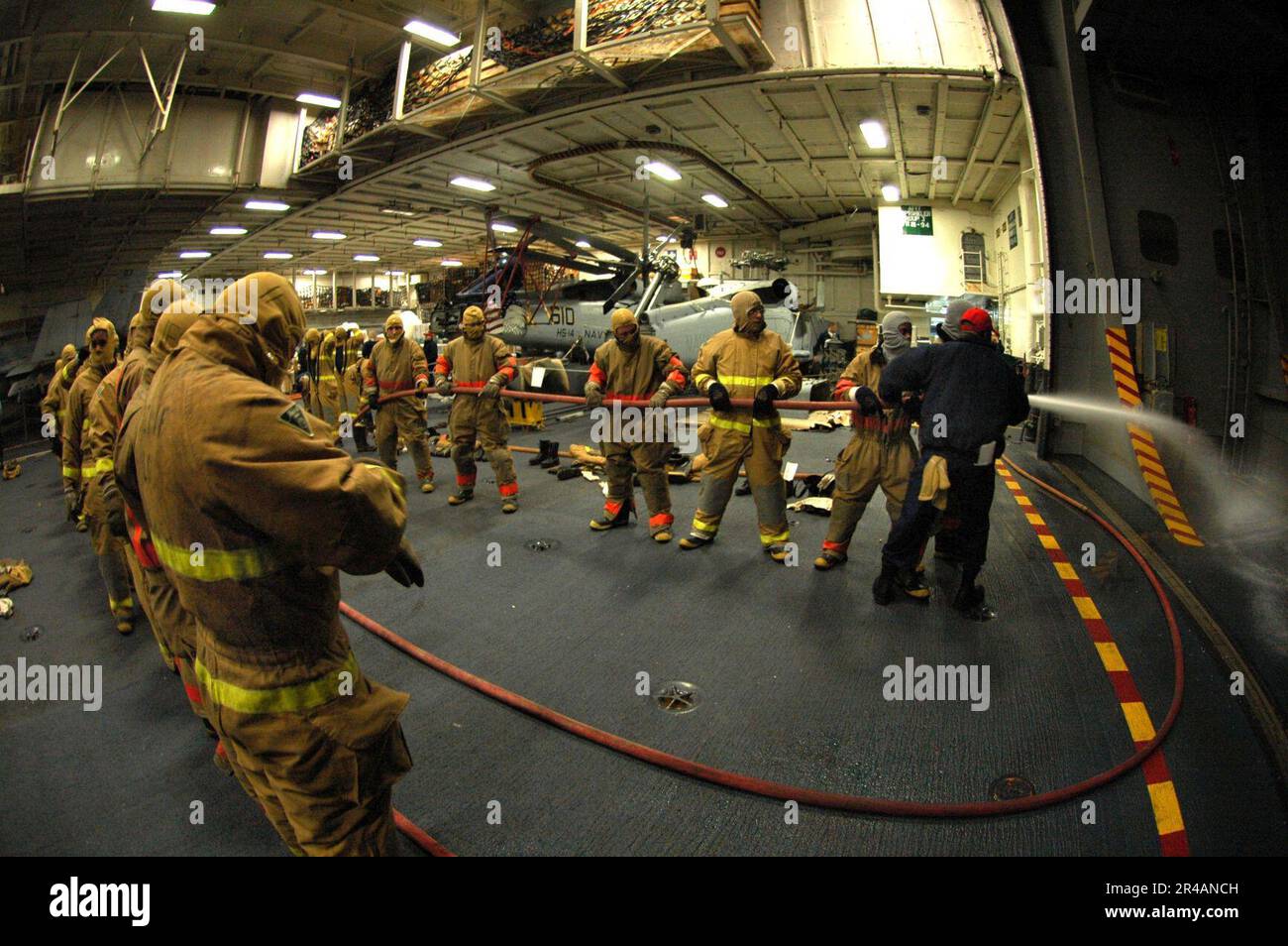 US Navy Crew members aboard the conventionally powered aircraft carrier ...