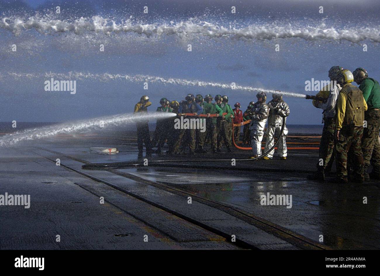 US Navy Carrier Air Wing Nine (CVW-9) and Air Department personnel work ...