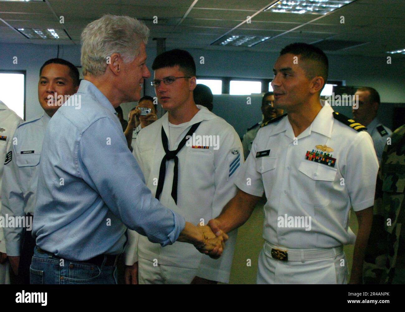 US Navy Former President William J. Clinton shakes the hand of Stock ...