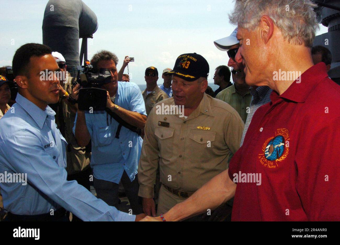 US Navy Former President William J. Clinton shakes the hand of Stock ...