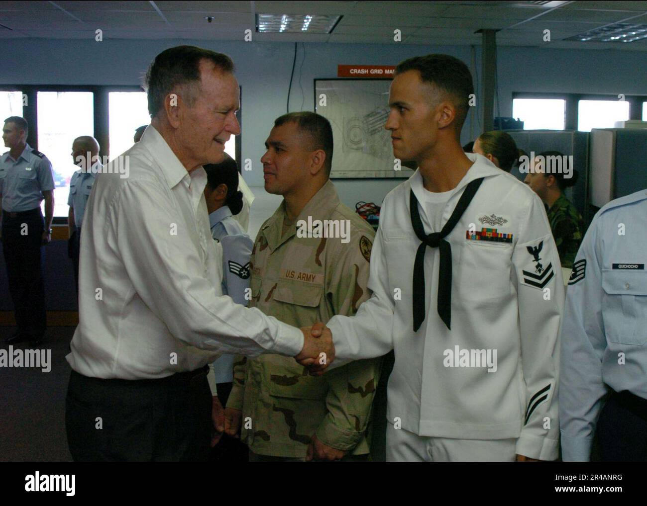 US Navy Former President George H. W. Bush shakes the hand of Builder ...