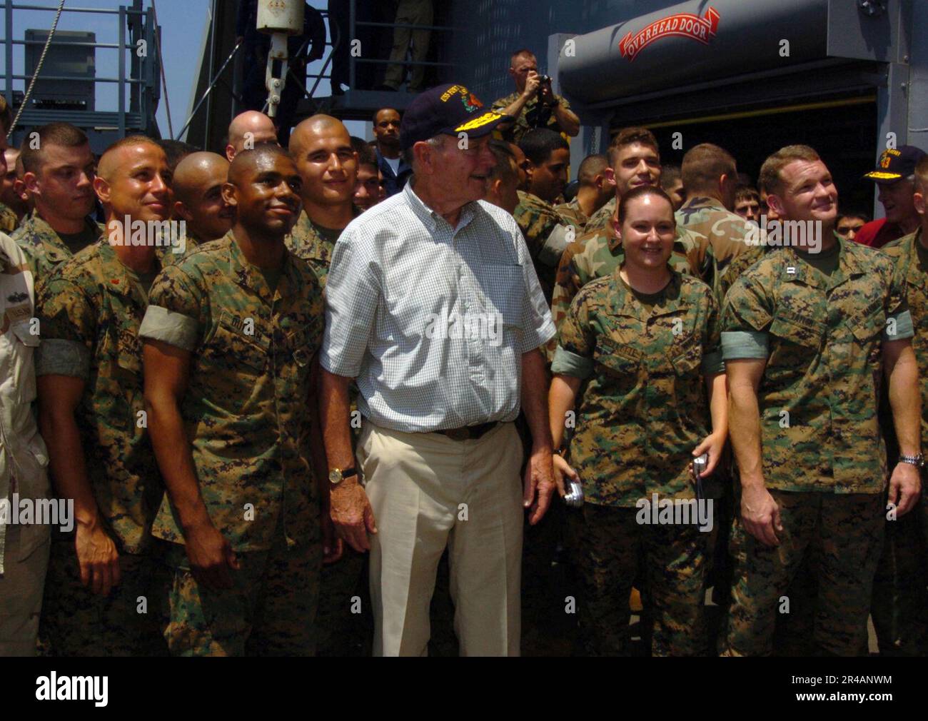 US Navy Former President George H. W. Bush is flanked by Marines while ...