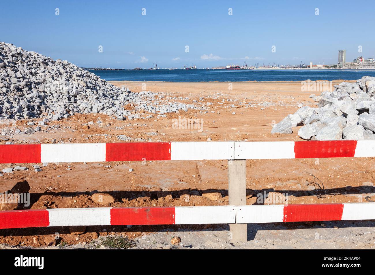 Construction area facing the bay of Luanda, Angola. Red and white ...