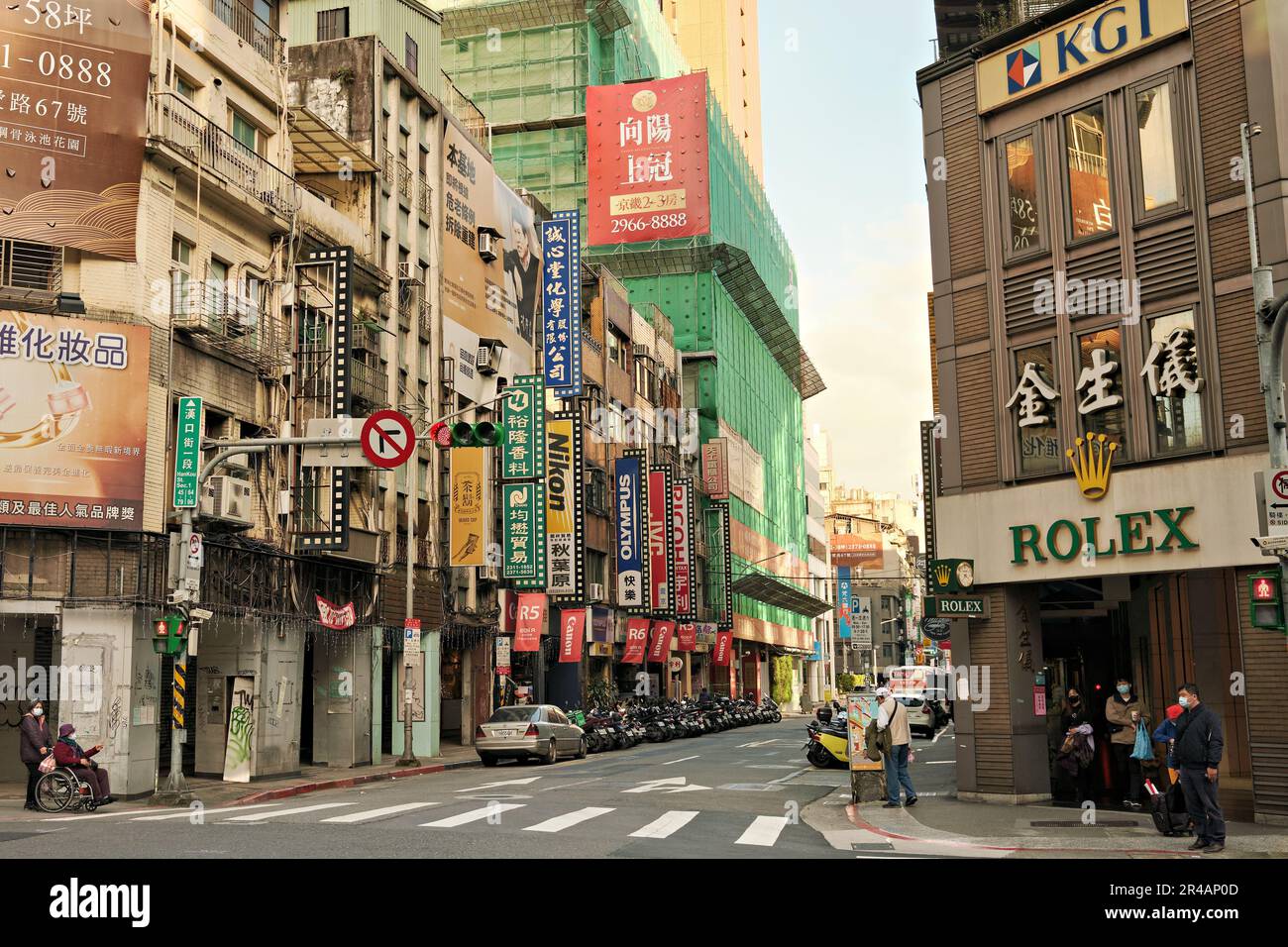 An urban street scene featuring a bustling crowd of pedestrians walking ...