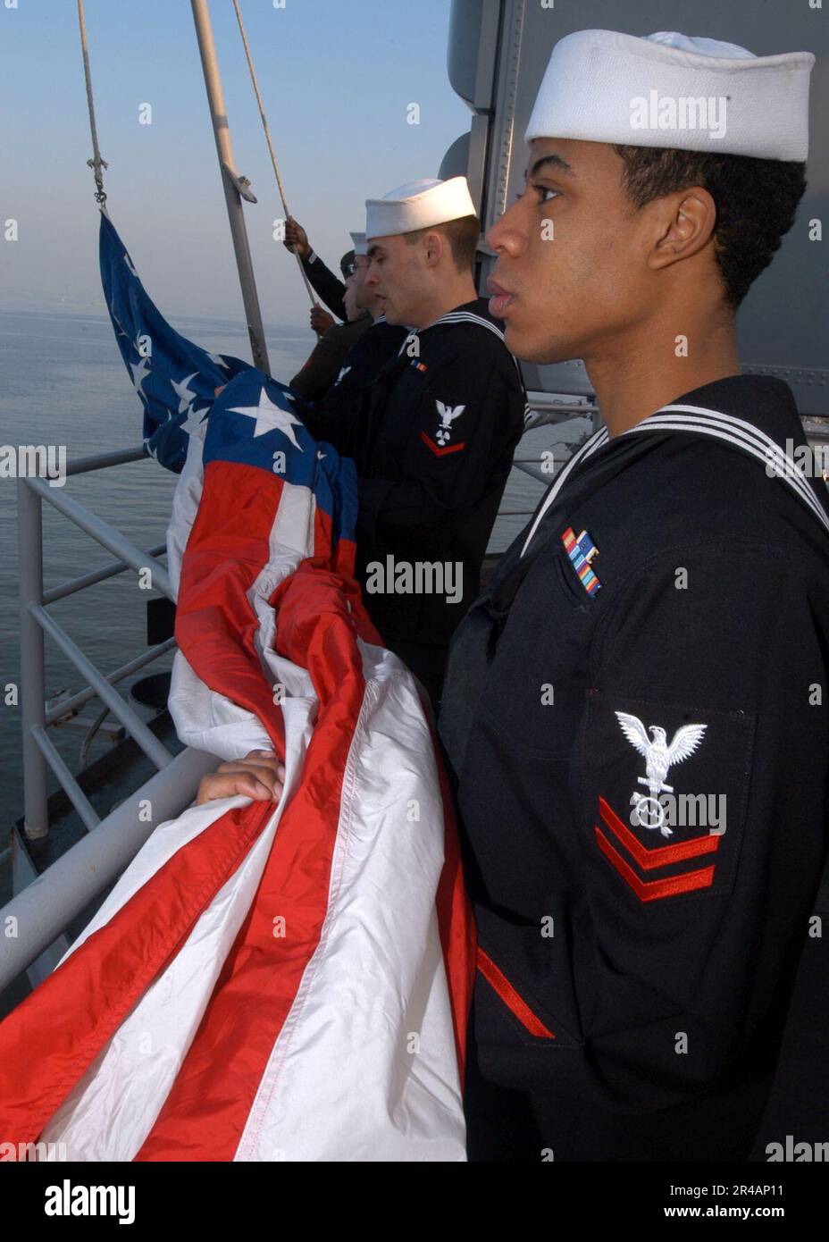 US Navy Sailors and Marines assigned to the color guard aboard the ...