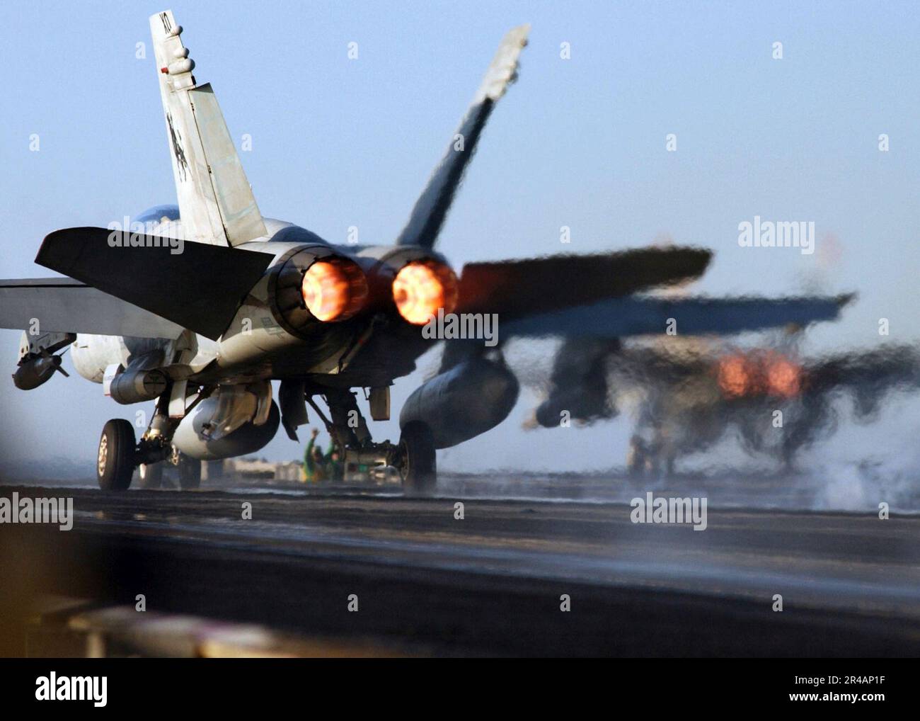 US Navy F-A-18C Hornets launch simultaneously from the flight deck ...