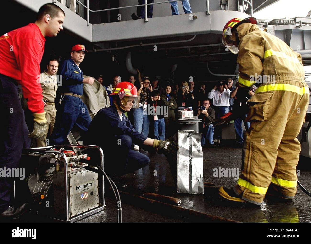 US Navy Damage Controlmen use a Portable Hydraulic Access Rescue System ...
