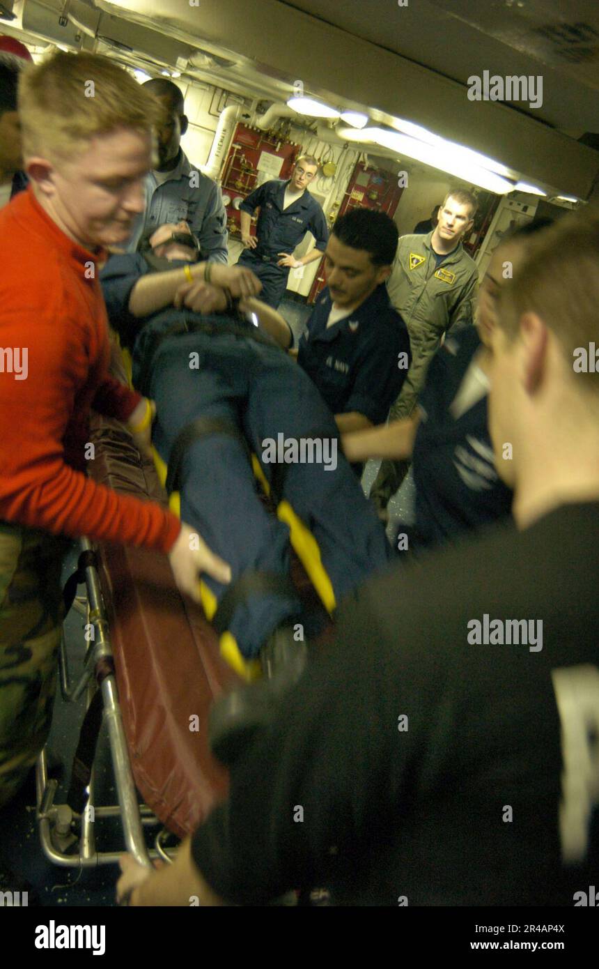 US Navy Medical Department personnel attend to a simulated victim ...