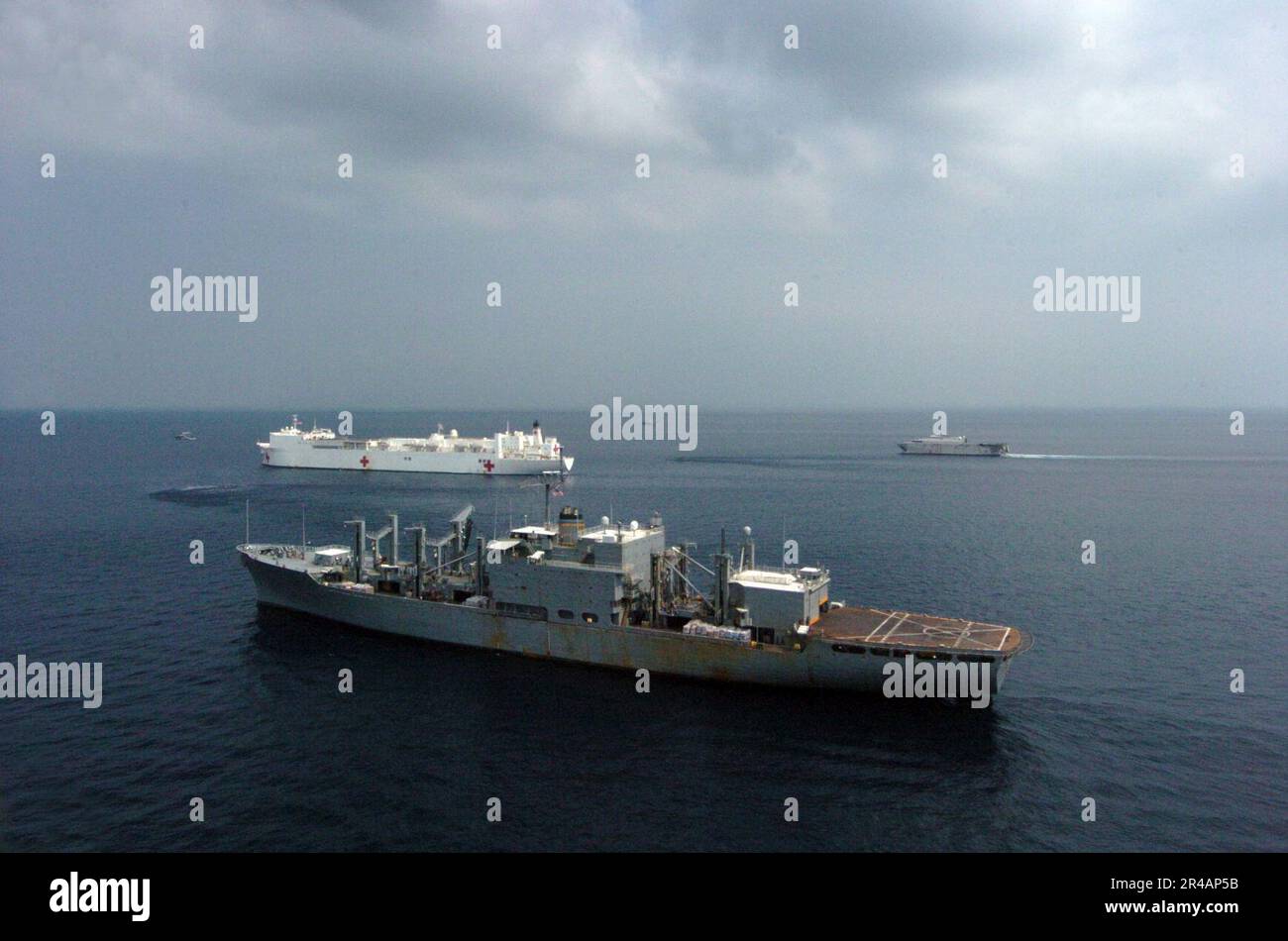 US Navy USNS San Jose (T-AFS 7), foreground, MSC hospital ship USNS ...