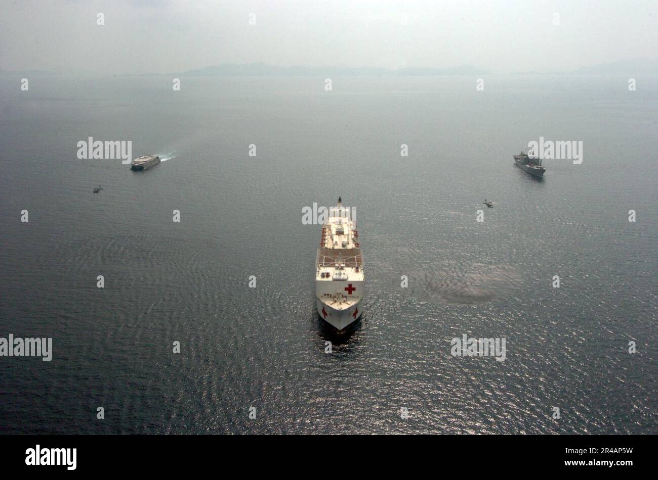 US Navy The High Speed Vessel Two (HSV 2) Swift, left, USNS Mercy (T-AH ...