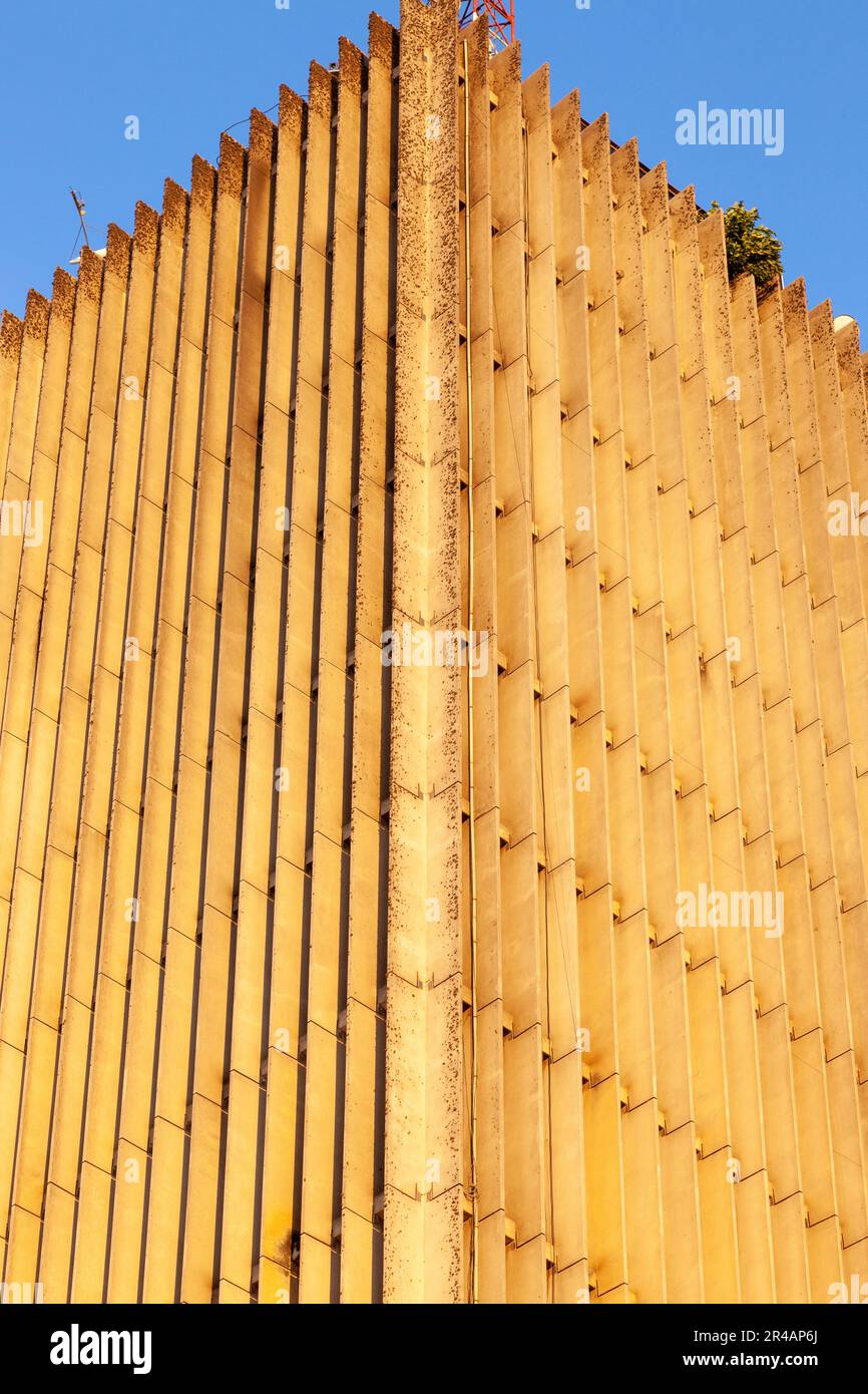 Dilapidated skyscraper under the setting sun. Luanda, Angola Stock ...