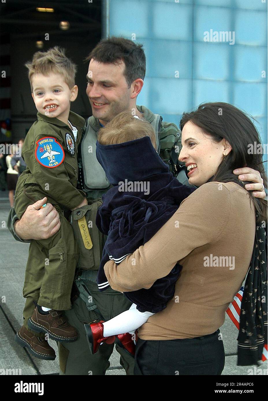 US Navy An air crew member greets his loved ones after returning from a ...