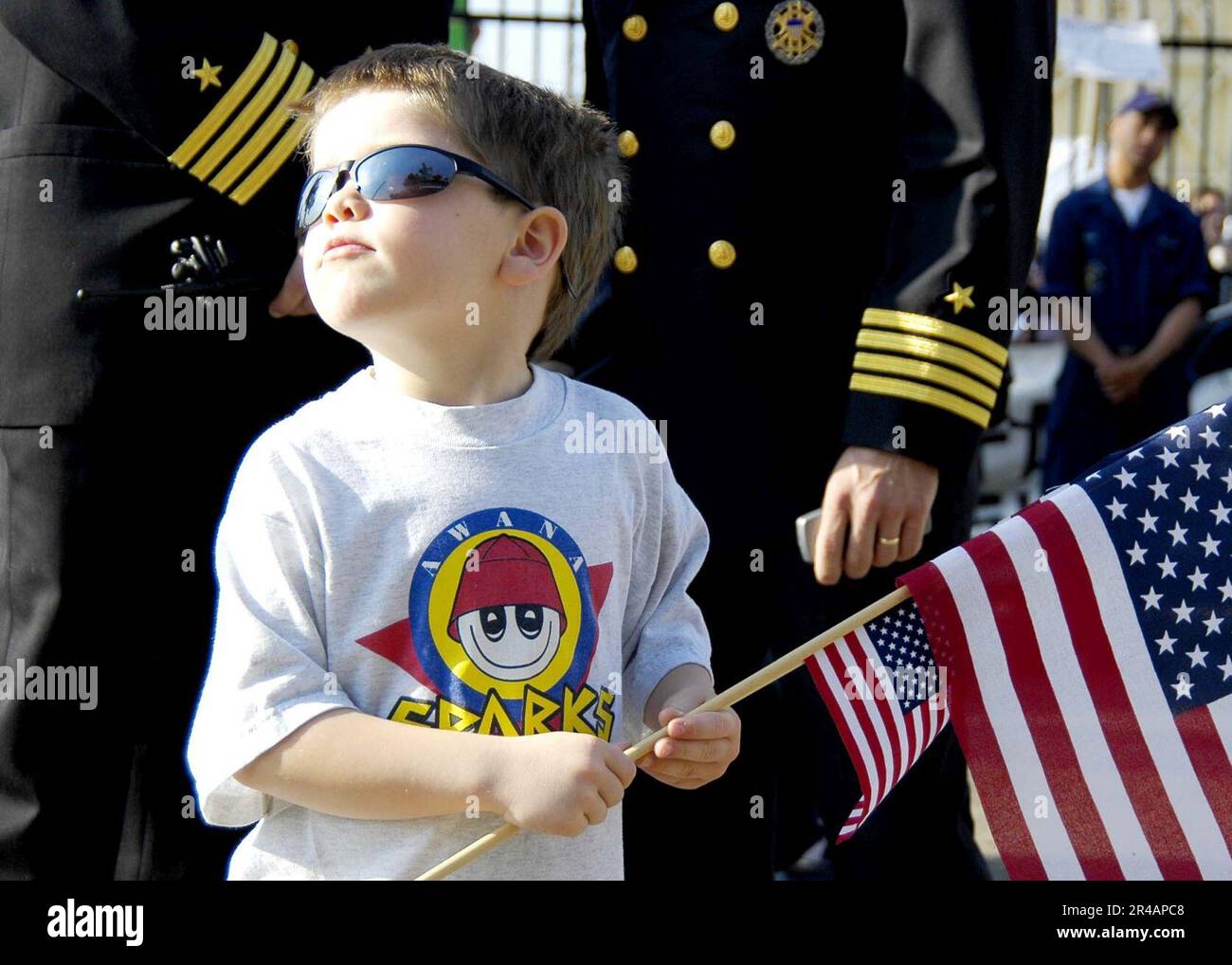 US Navy A child waits for the return of his father on board Naval Air ...