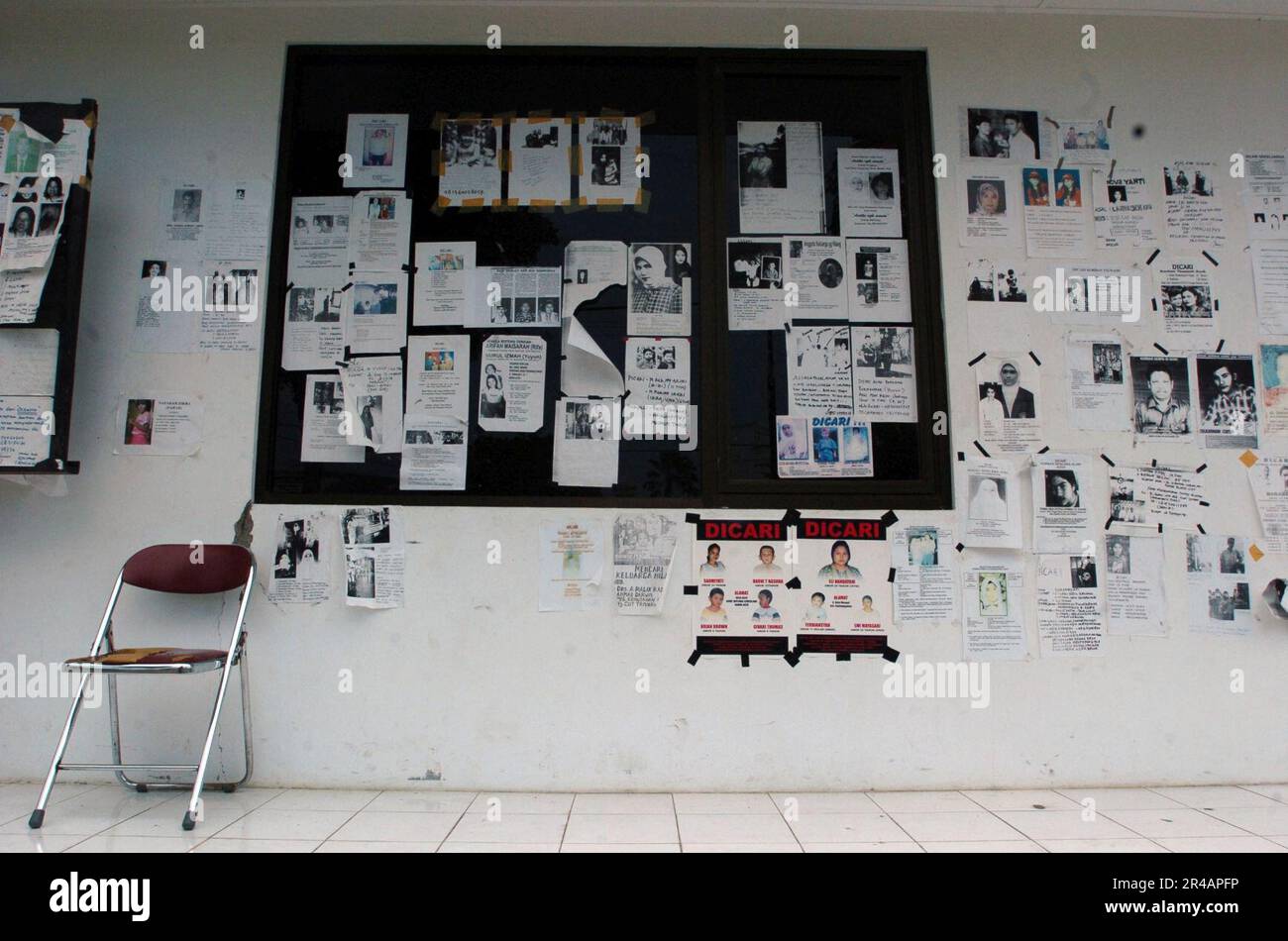 US Navy Flyers with information about missing persons line the walls ...