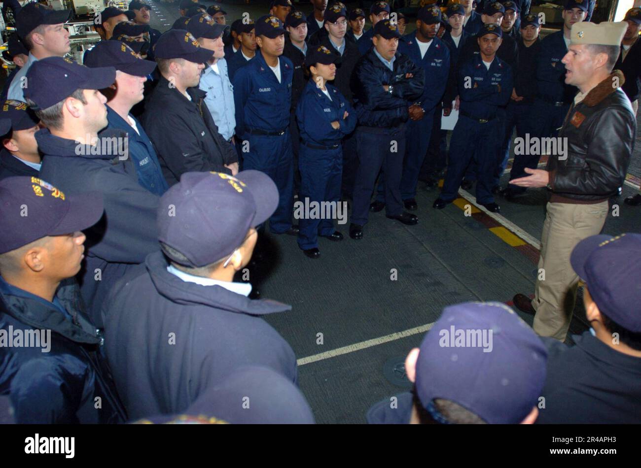 US Navy Air Boss, Cmdr. James Cox, talks to his Sailors in Air ...