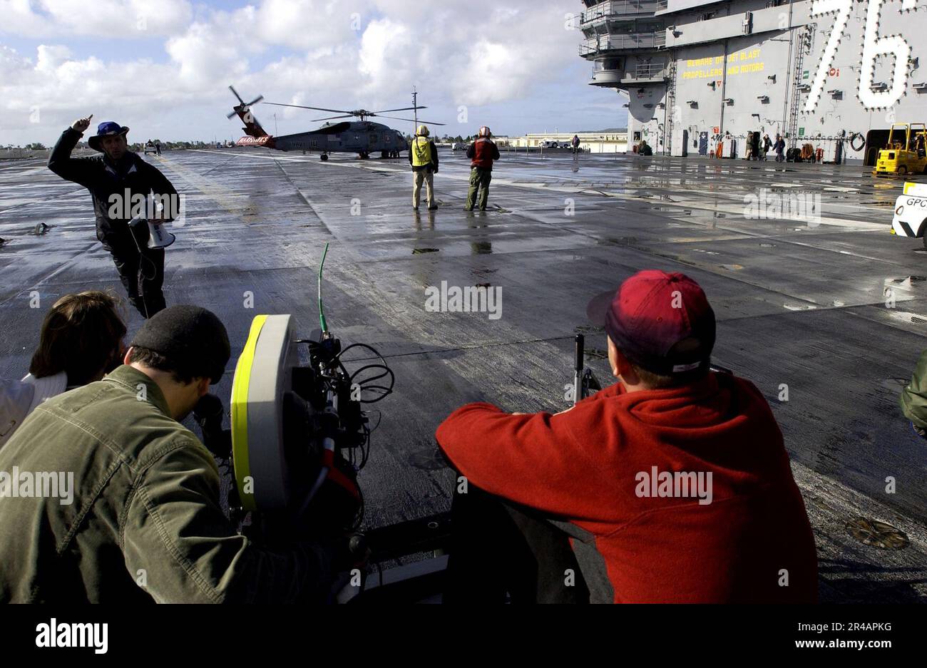 US Navy A member of an NBC television crew shouts Roll Camera, ACTION ...