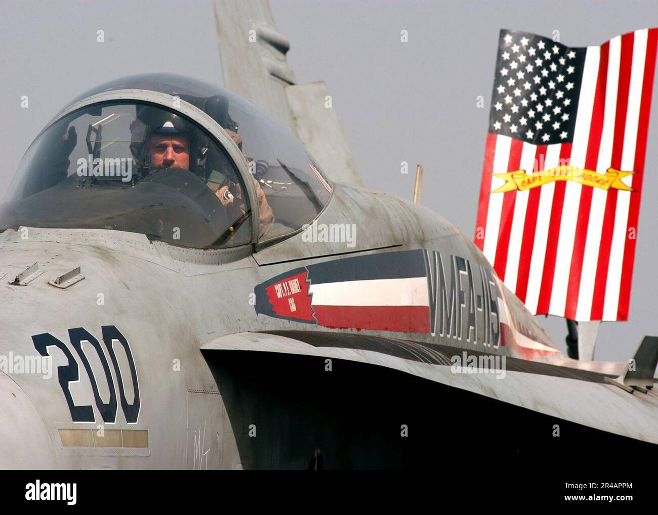 US Navy pilot of an F-A-18A- Hornet conducts a check of his speed break ...